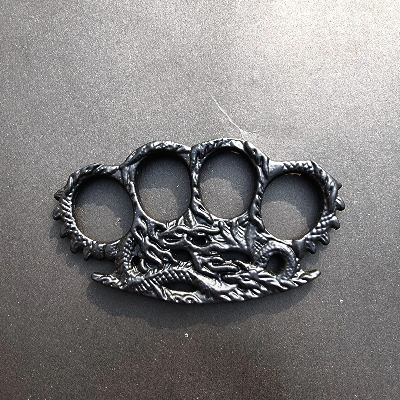 "Black Dragon Knuckle – Fierce Gripper with Intricate Design" | Daraz.pk